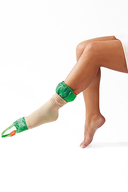 Sim-Slide för både på- och avtagning av kompressionsstrumpor